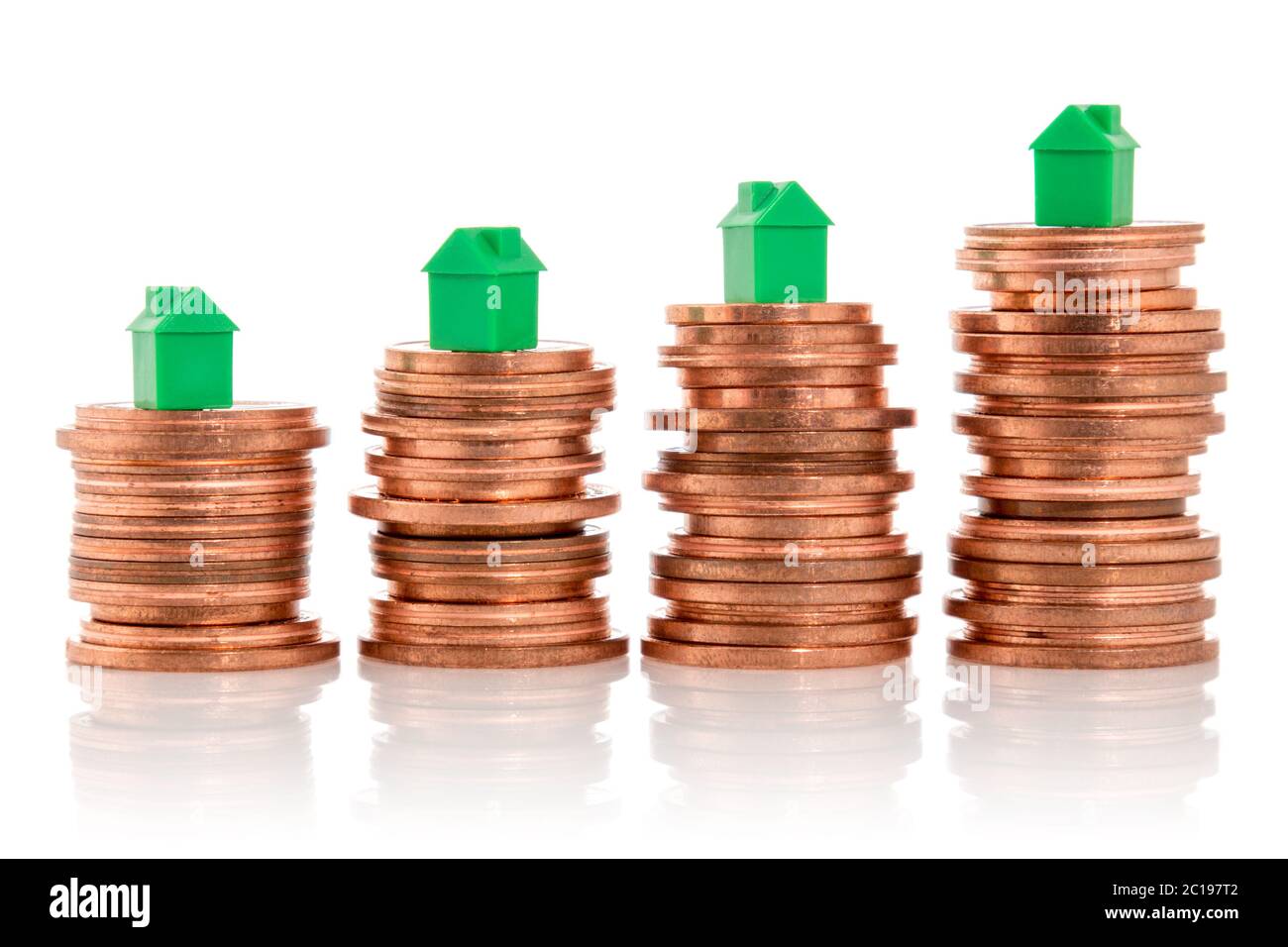 Stacked coins with mini houses on the top Stock Photo - Alamy