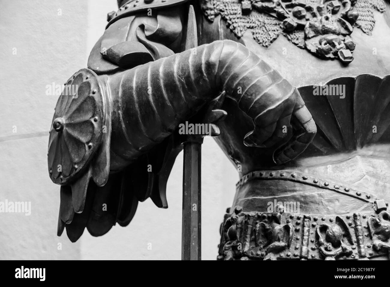 Hand in armour of the medieval knight statue Stock Photo - Alamy