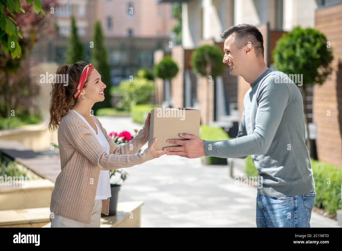 Man passing box hi-res stock photography and images - Alamy