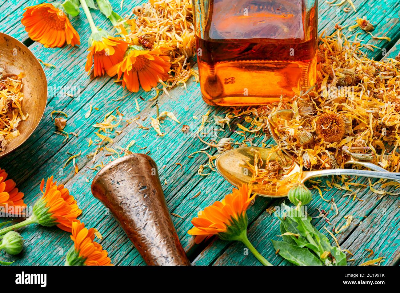Medicinal tincture of calendula flowers, medicinal wild herbs Stock ...