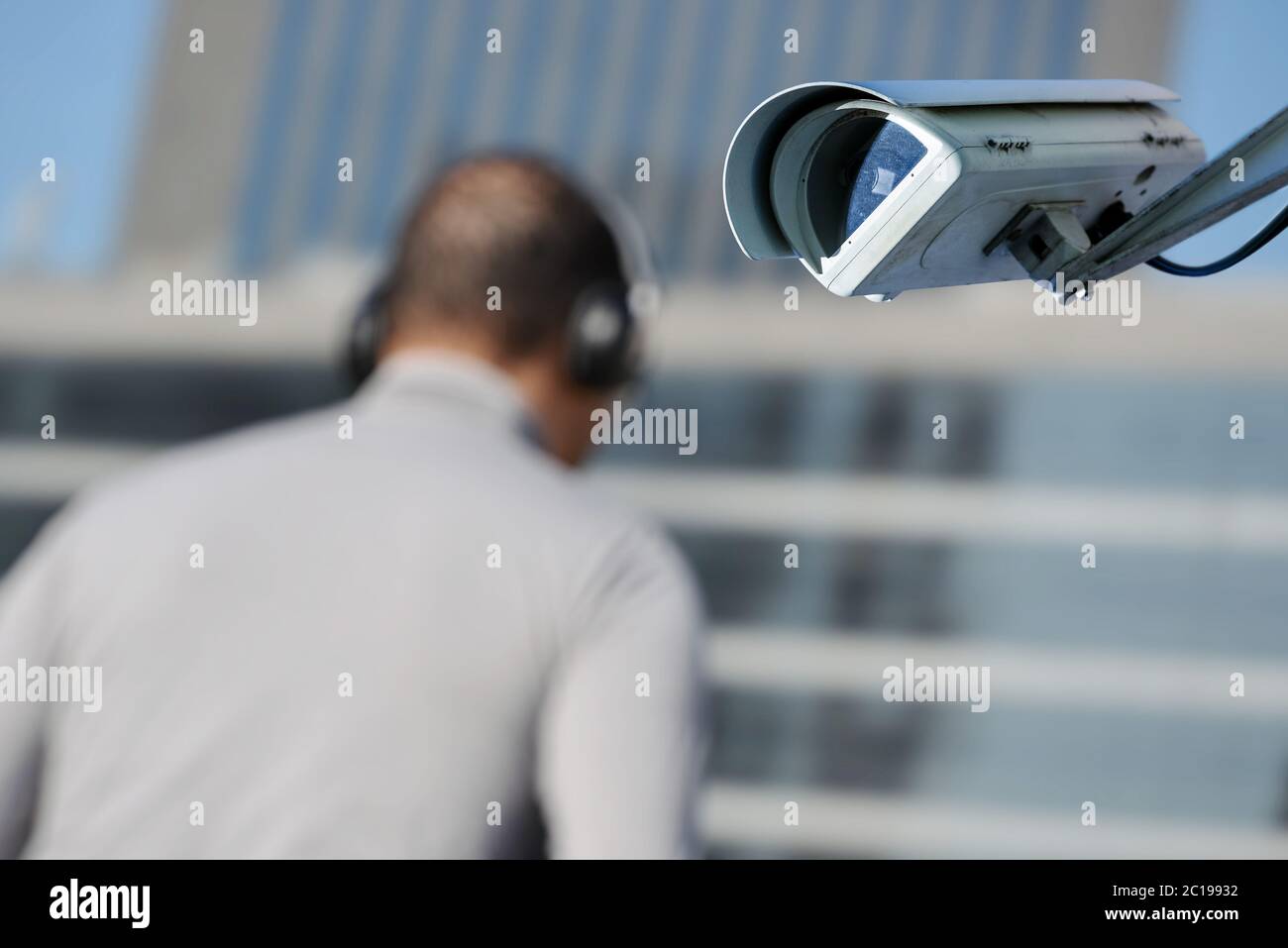 security CCTV camera or surveillance system with man on blurry ...