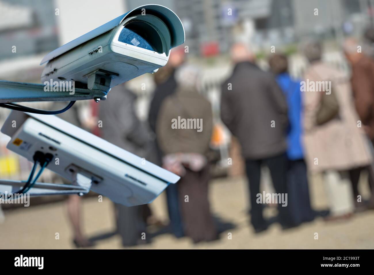 security CCTV camera or surveillance system on the street with retired ...