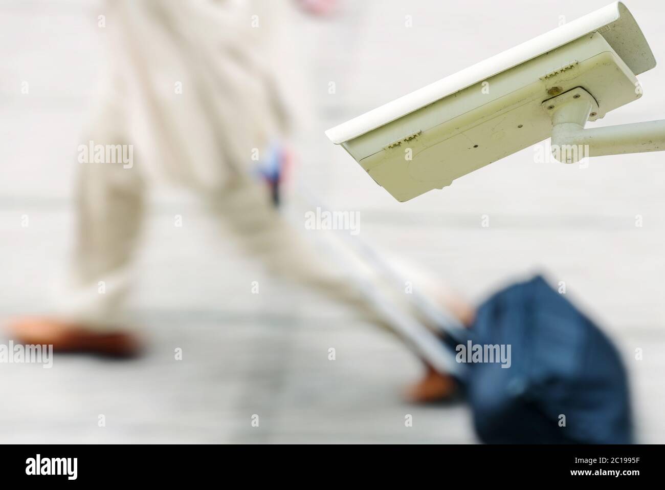 security CCTV camera or surveillance system with business man walking ...