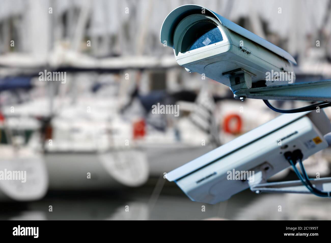 security CCTV camera or surveillance system with Marina on blurry ...