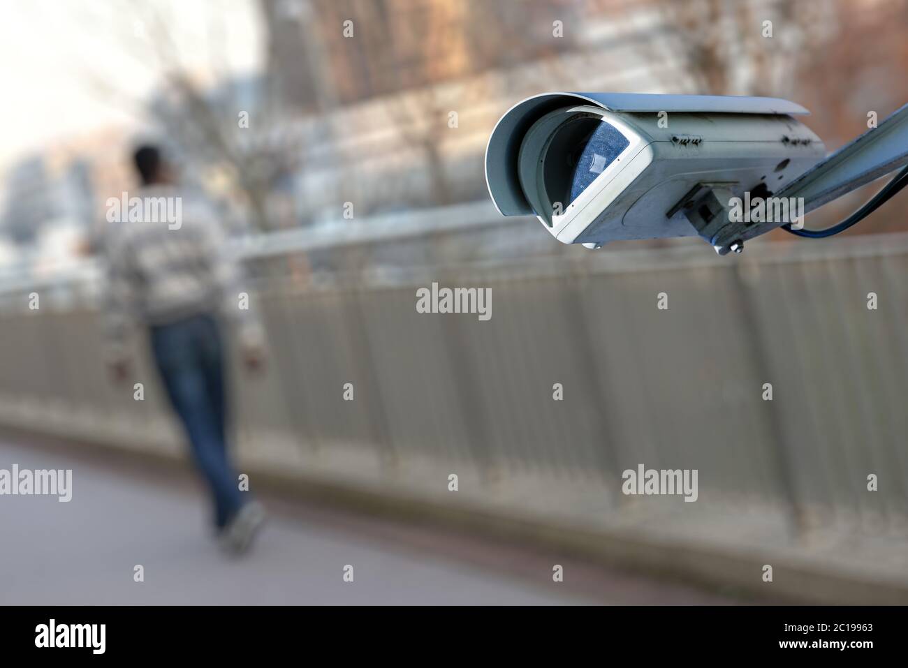 security CCTV camera or surveillance system with man on blurry ...