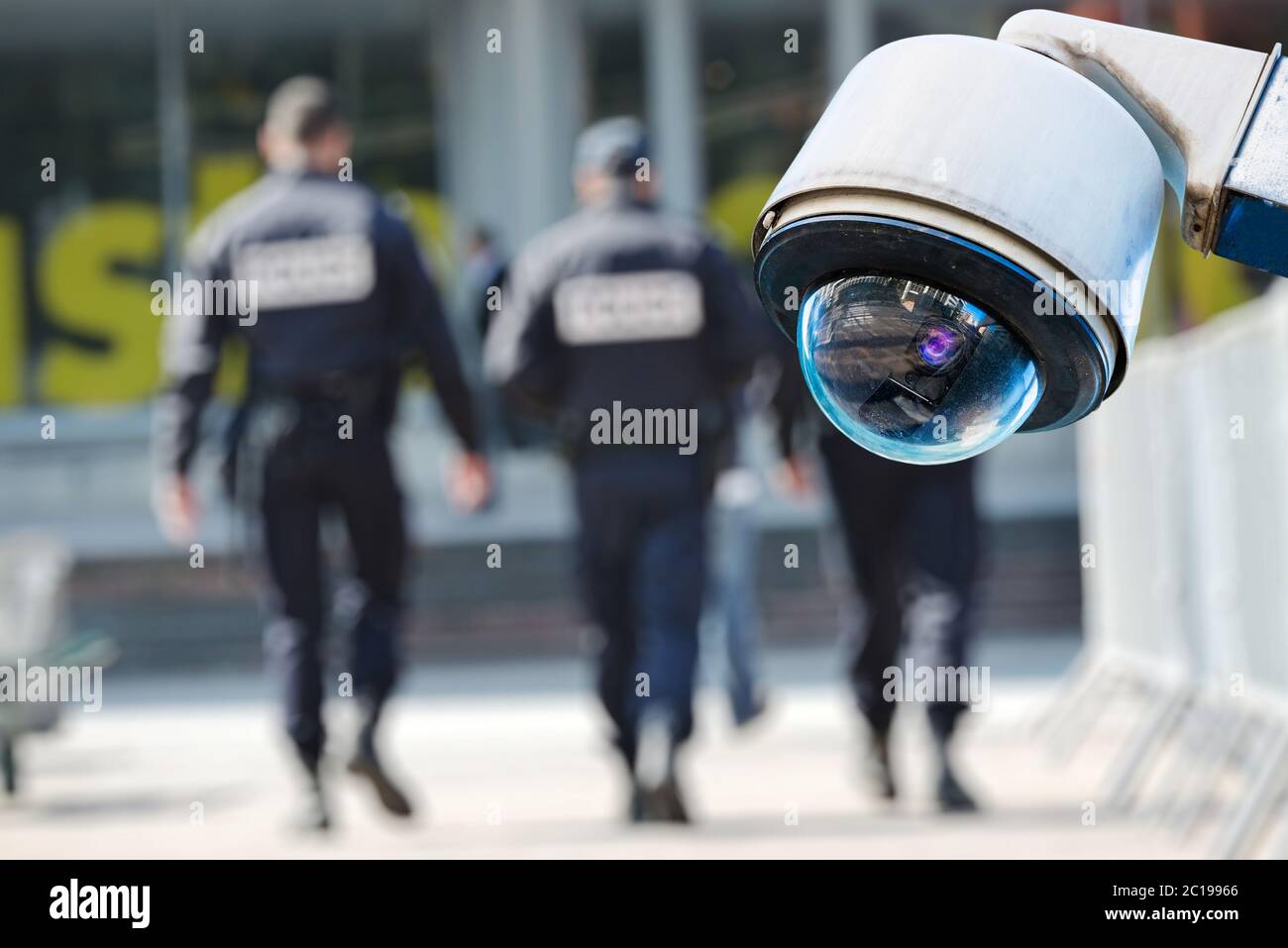 security CCTV camera or surveillance system with military on blurry ...