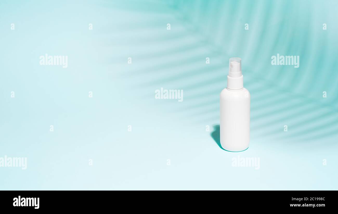 White spray container on clean blue background, place for text Stock ...