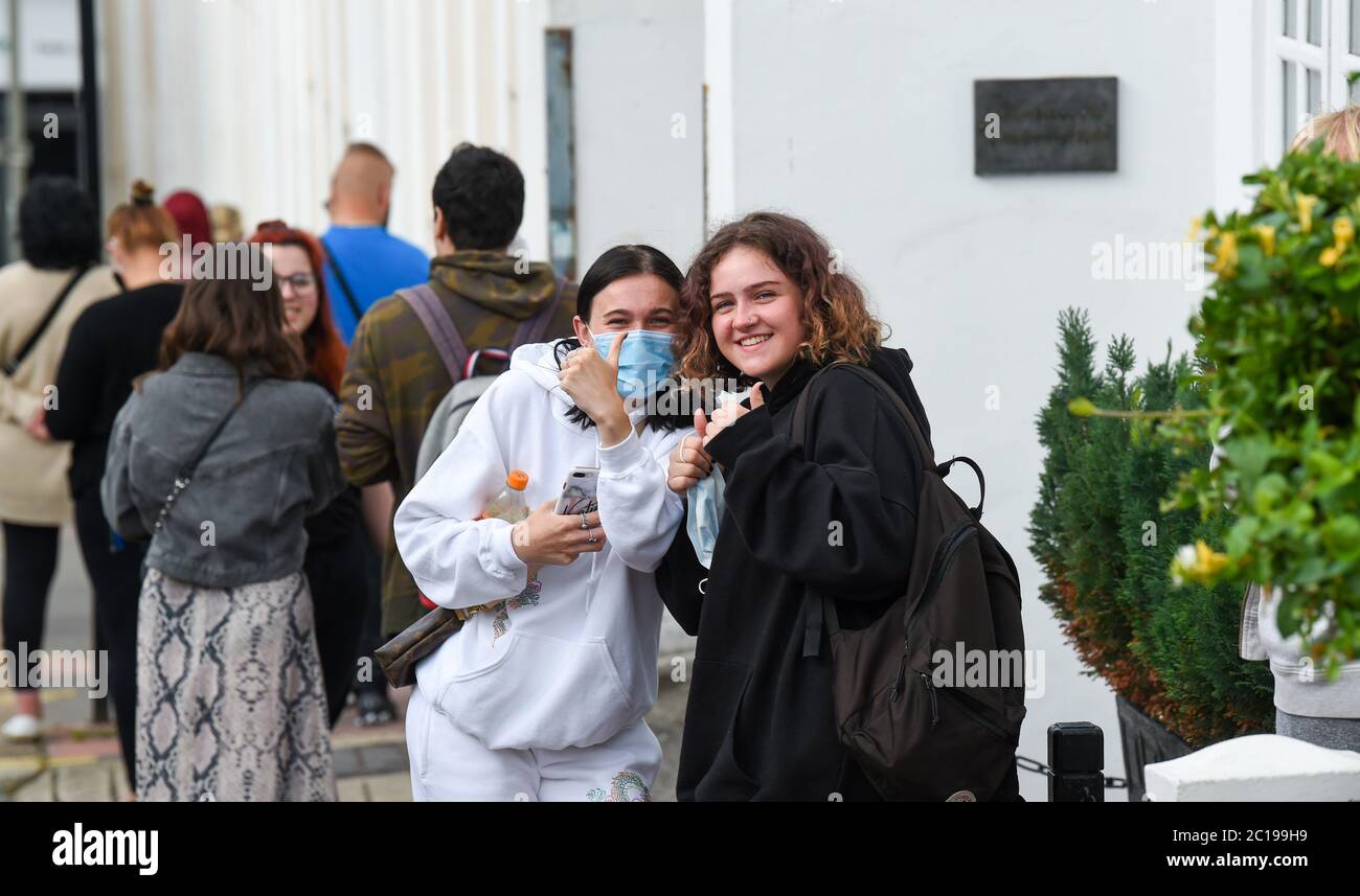 Happy shoppers in queue hi-res stock photography and images - Alamy