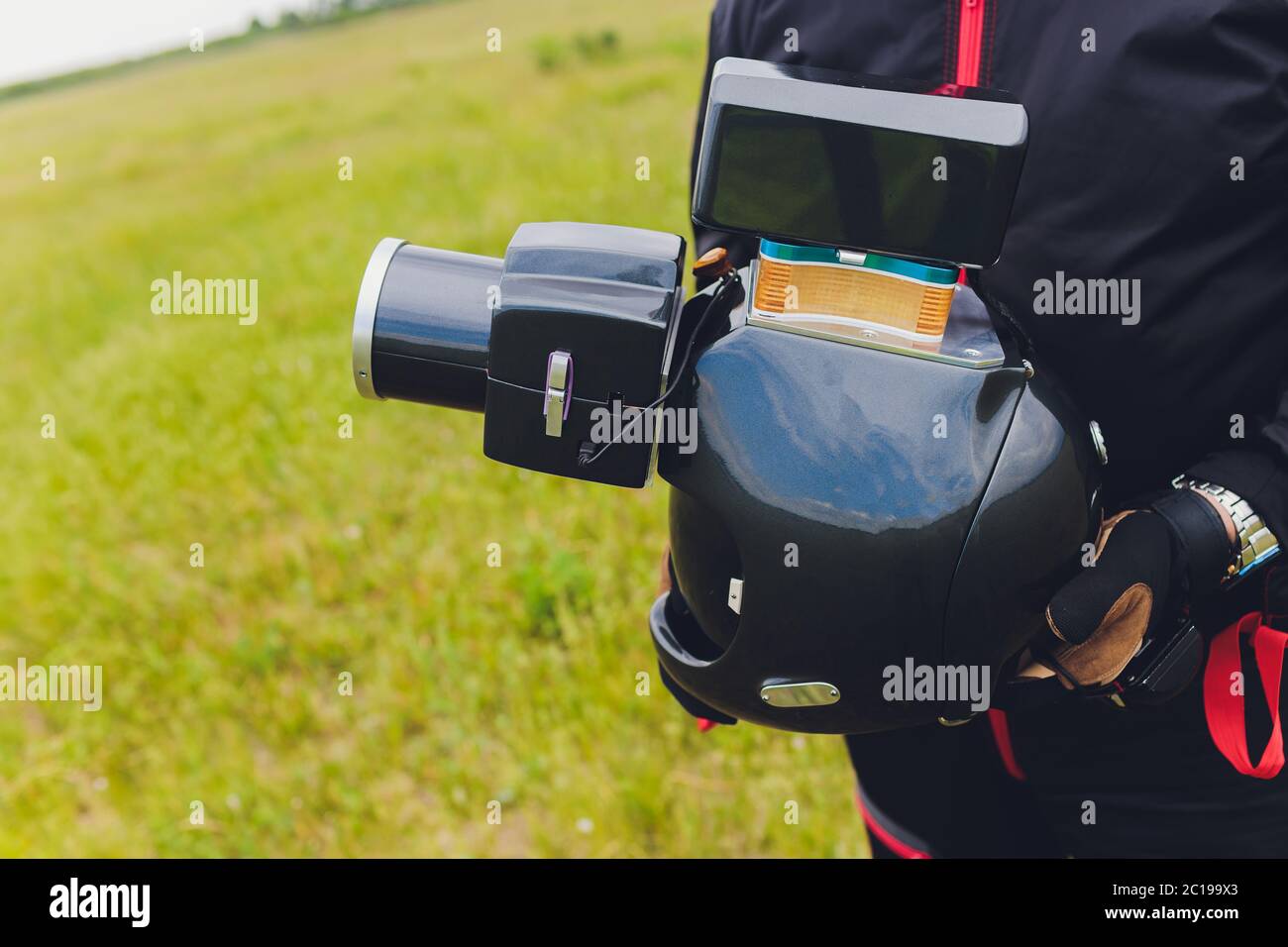 Parachute helmet with an installed DSLR camera in the hands of a ...