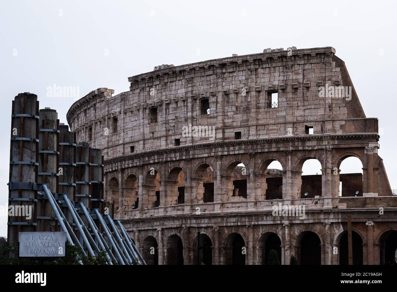 Ancient columns of the Sacred Way next to the Colosseum in Rome, Italy ...