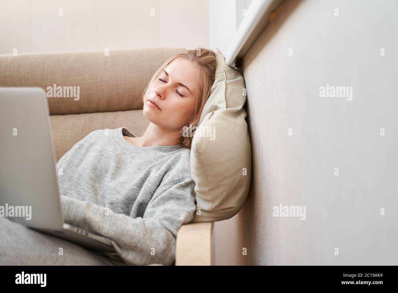 Girl sleeping in armchair hi-res stock photography and images - Alamy