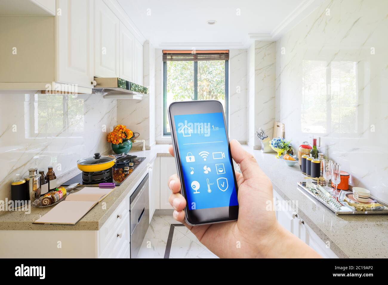 smart phone with smart home with modern kitchen Stock Photo - Alamy