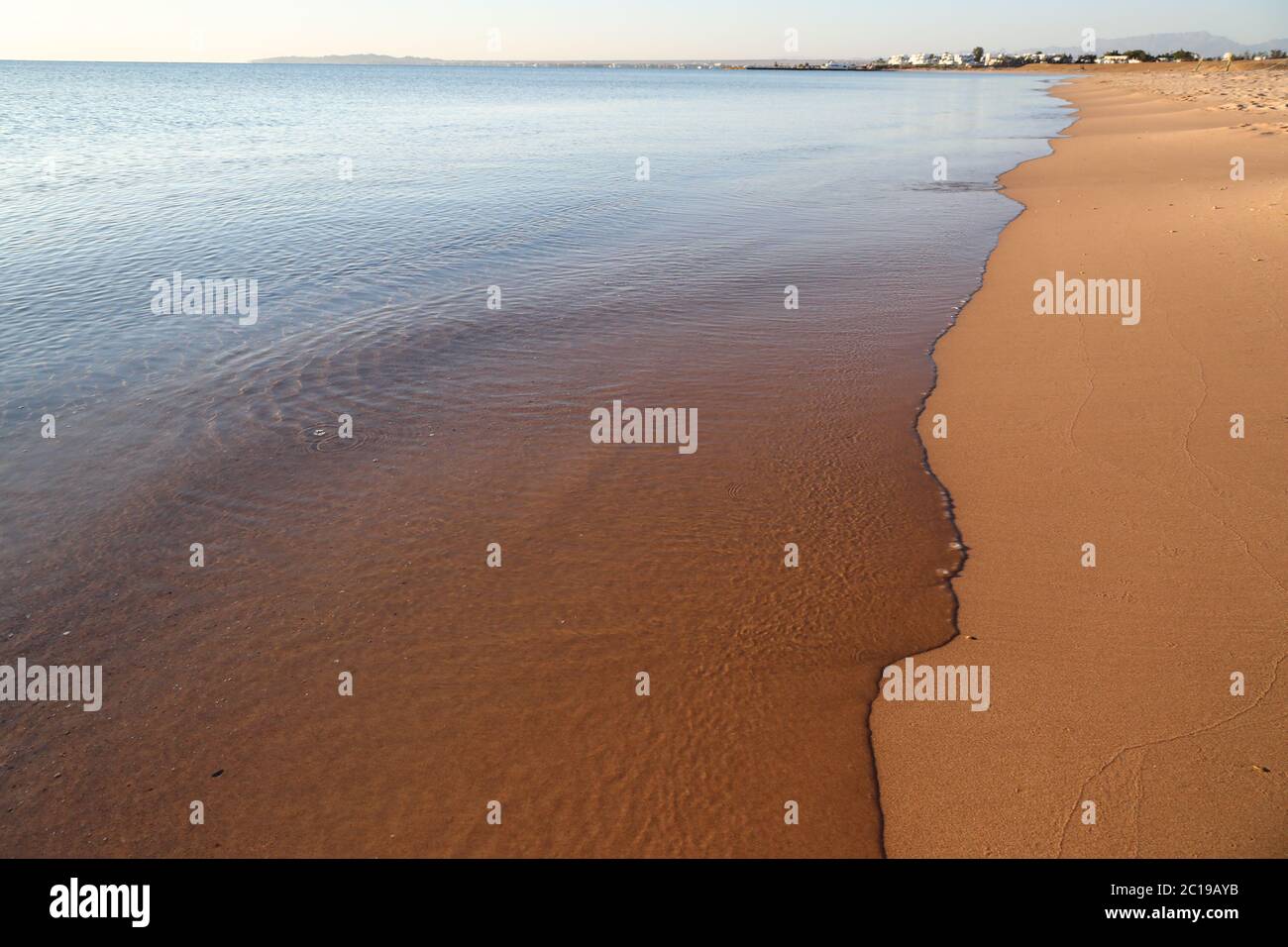 calm transparent sea and the sandy beach Stock Photo - Alamy