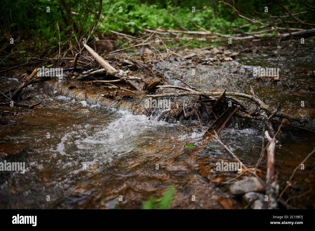 Beautiful nature waterfall on a small lake Stock Photo - Alamy