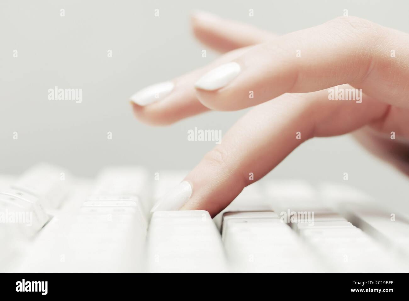 Female hand typing on computer keyboard Stock Photo - Alamy