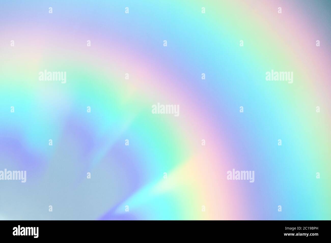 Blurred rainbow light refraction texture on white wall Stock Photo - Alamy