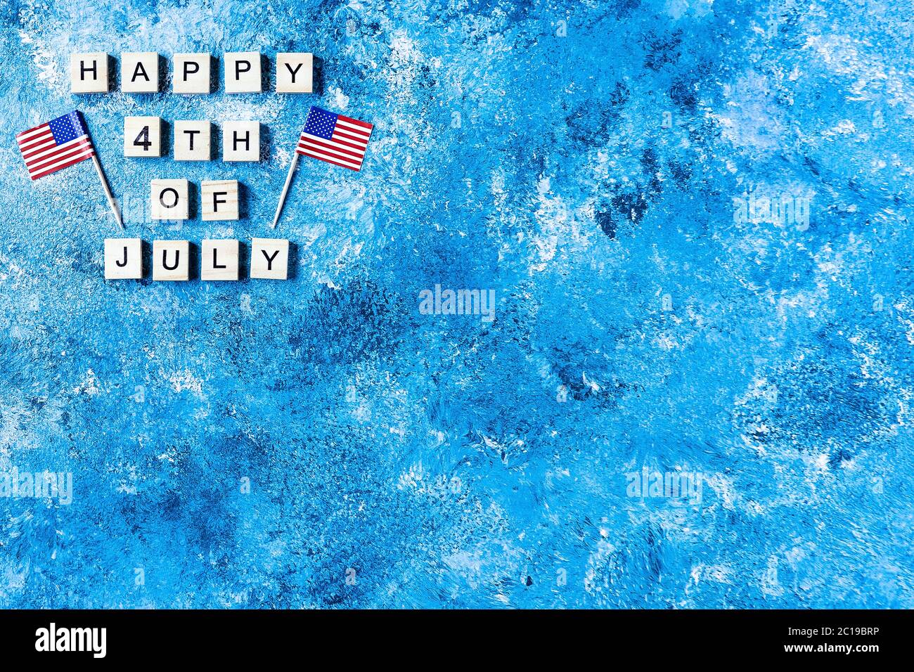 the inscription July 4 in wooden letters on a blue background. Design ...