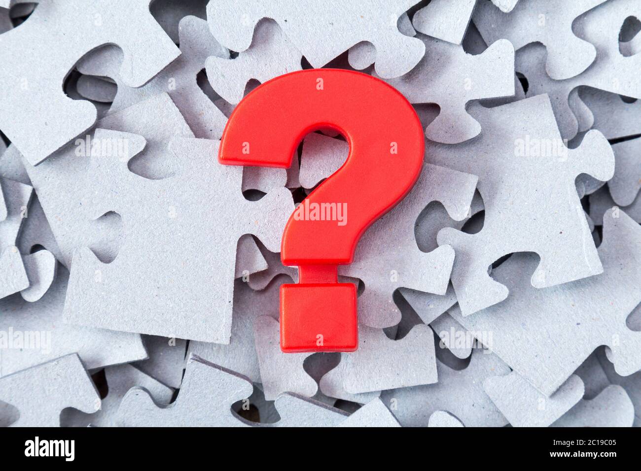 Puzzle and red question mark Stock Photo - Alamy