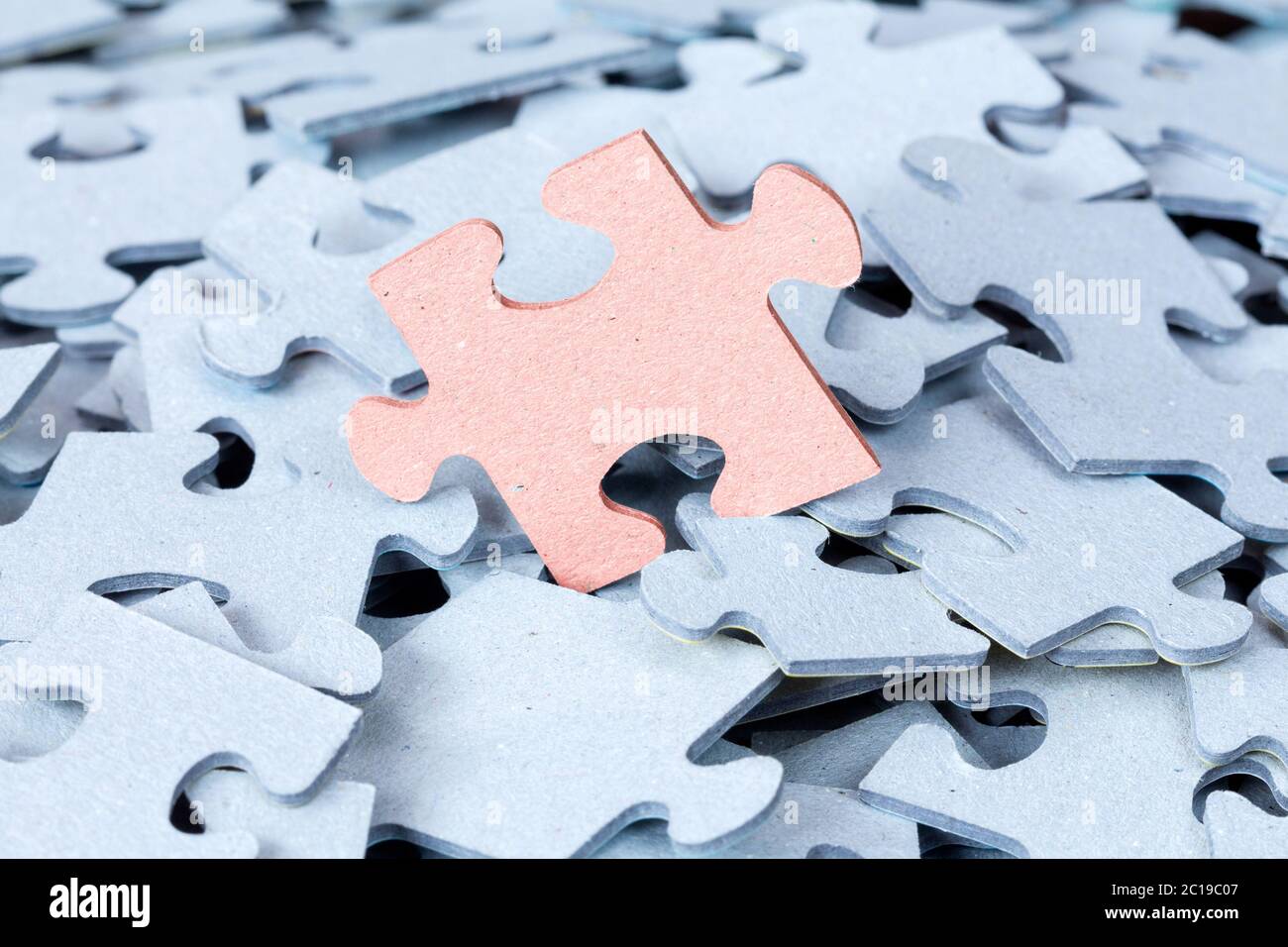 Jigsaw puzzle pile Stock Photo - Alamy