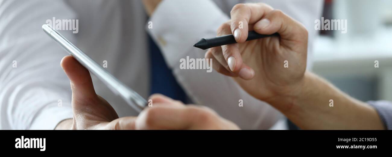 Men in workplace and sign an electronic document Stock Photo - Alamy
