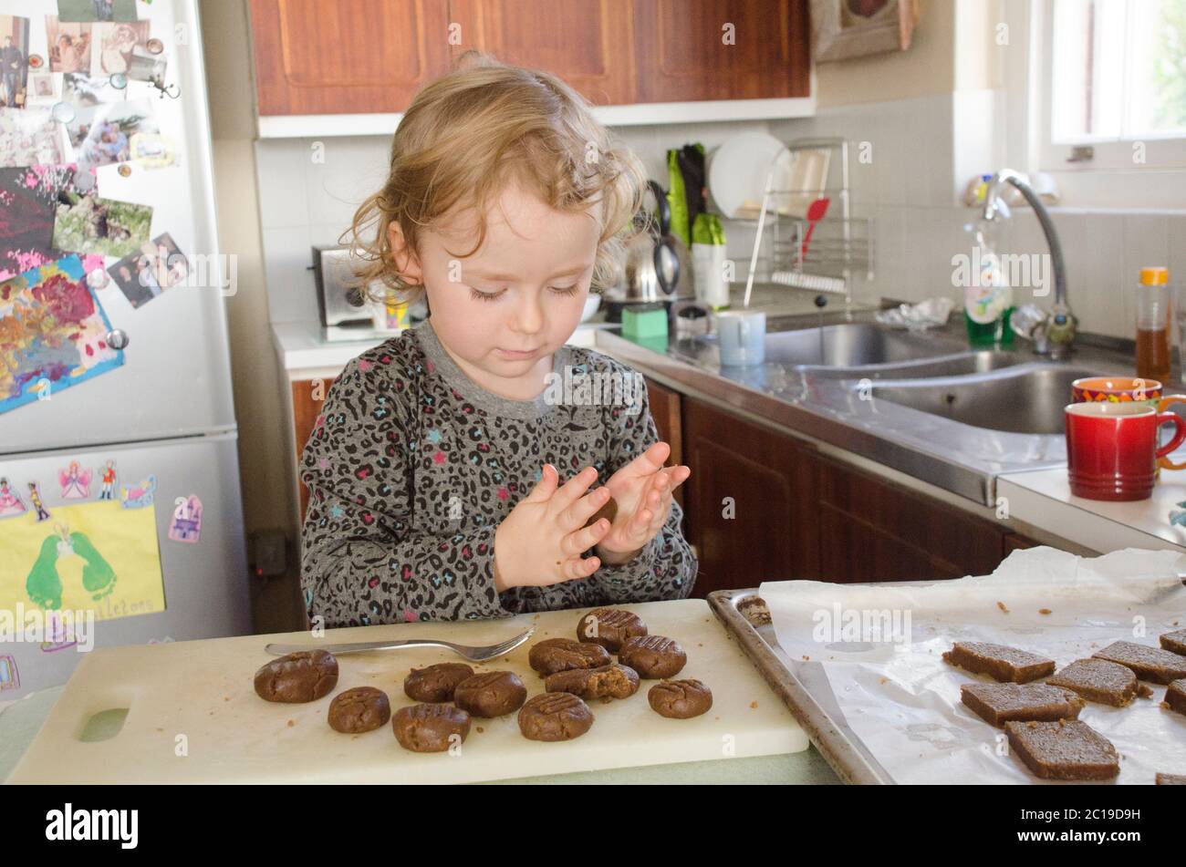 Child and biscuit hi-res stock photography and images - Alamy