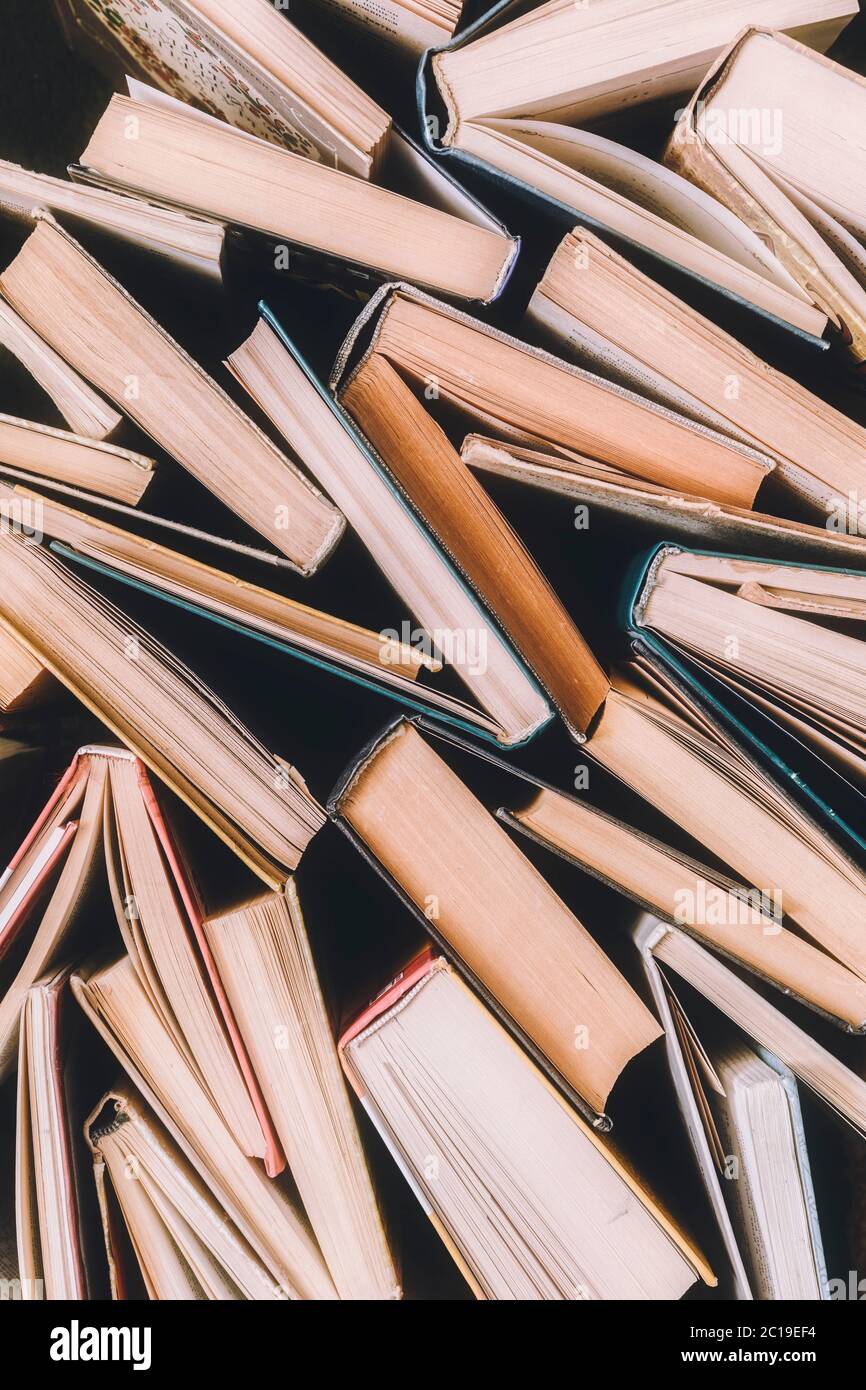 A set of books of different sizes lying on the floor Stock Photo - Alamy