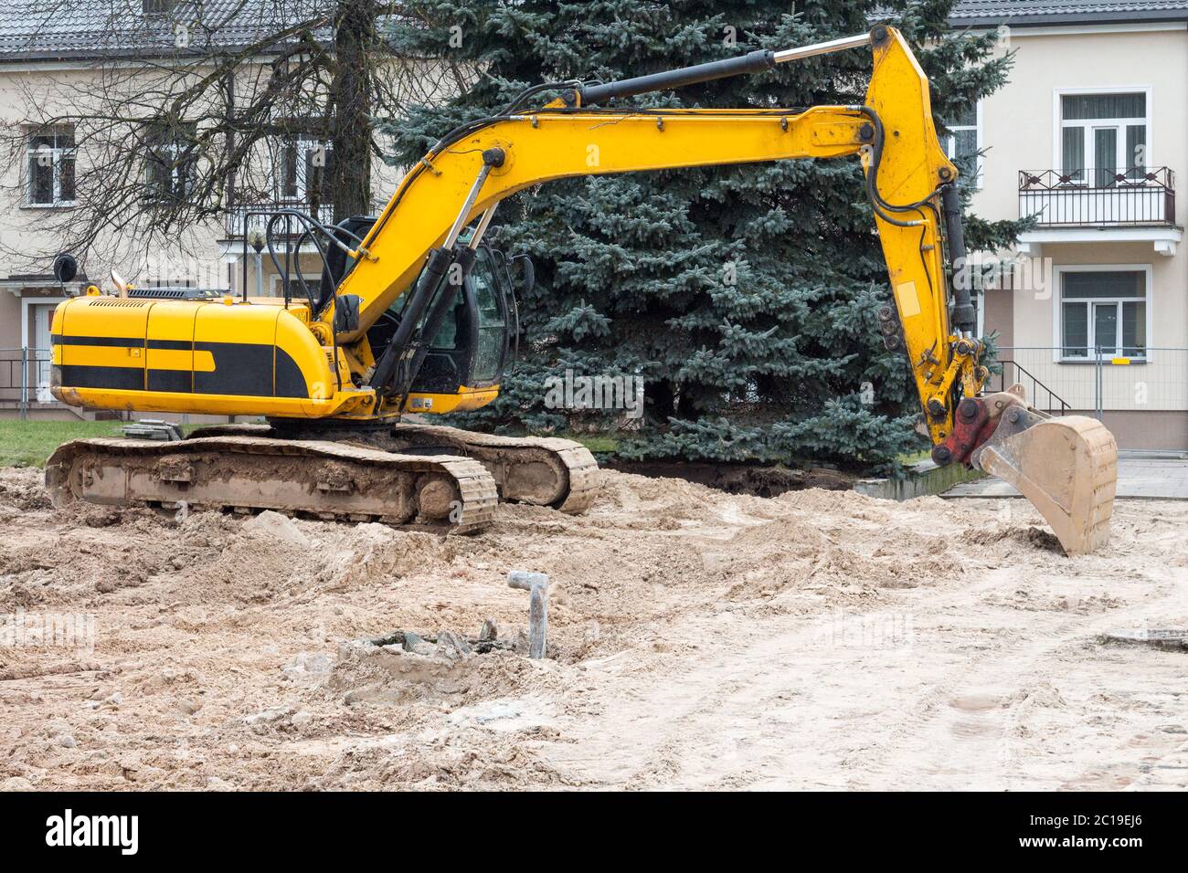 Yellow excavator machine Stock Photo - Alamy