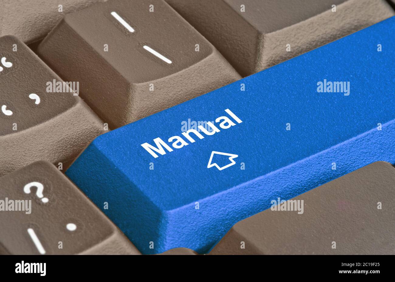 Keyboard with key for manual Stock Photo - Alamy