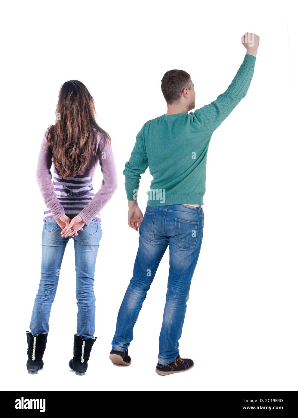 Back view of couple in sweater pointing. Rear view people collection ...