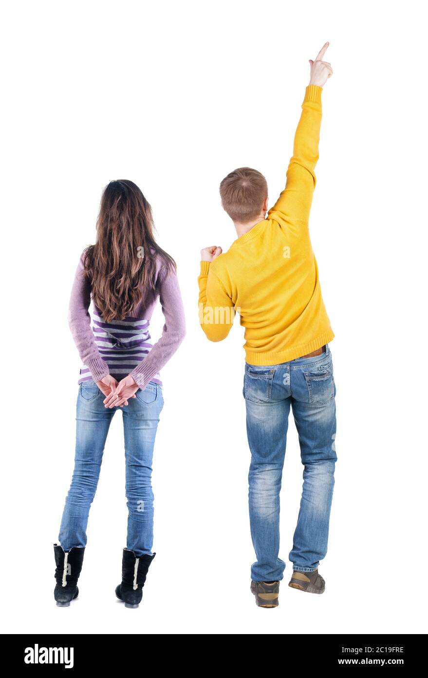 Back view of couple in sweater pointing. Rear view people collection ...