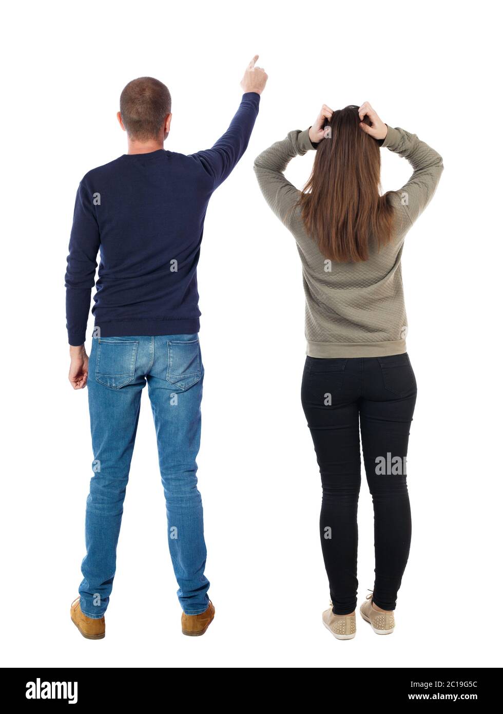 Back view of couple in sweater pointing. Rear view people collection ...