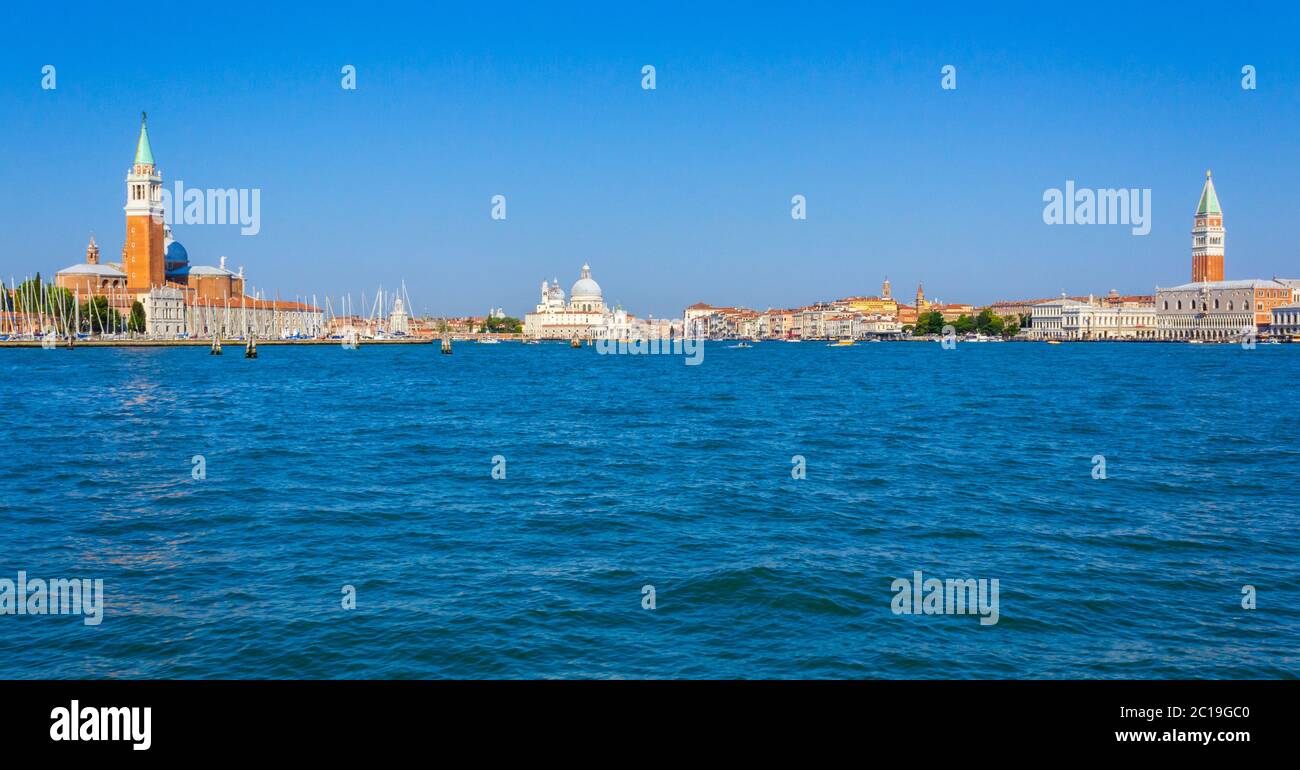 Summertime view of Venice cityscape,lagoon with tour boats navigating ...