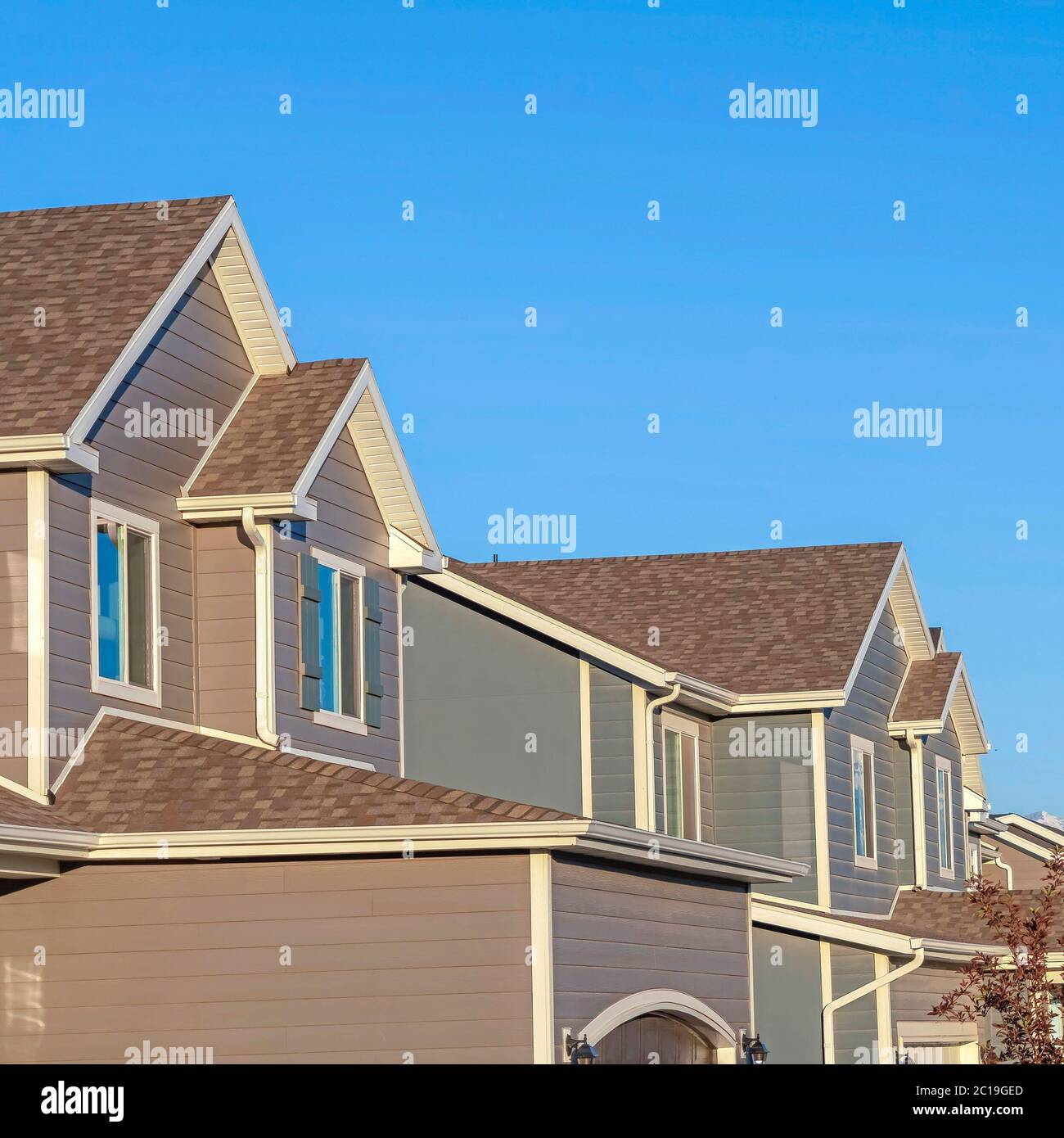 Square Row of houses in a suburb neighborhood with mountain and blue ...