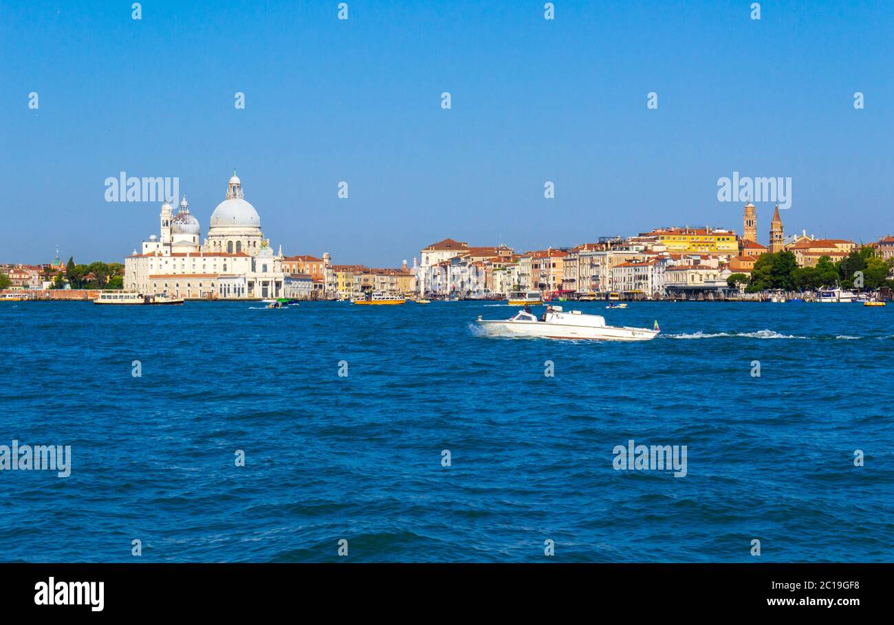 Summertime view of Venice cityscape,lagoon with tour boats navigating ...