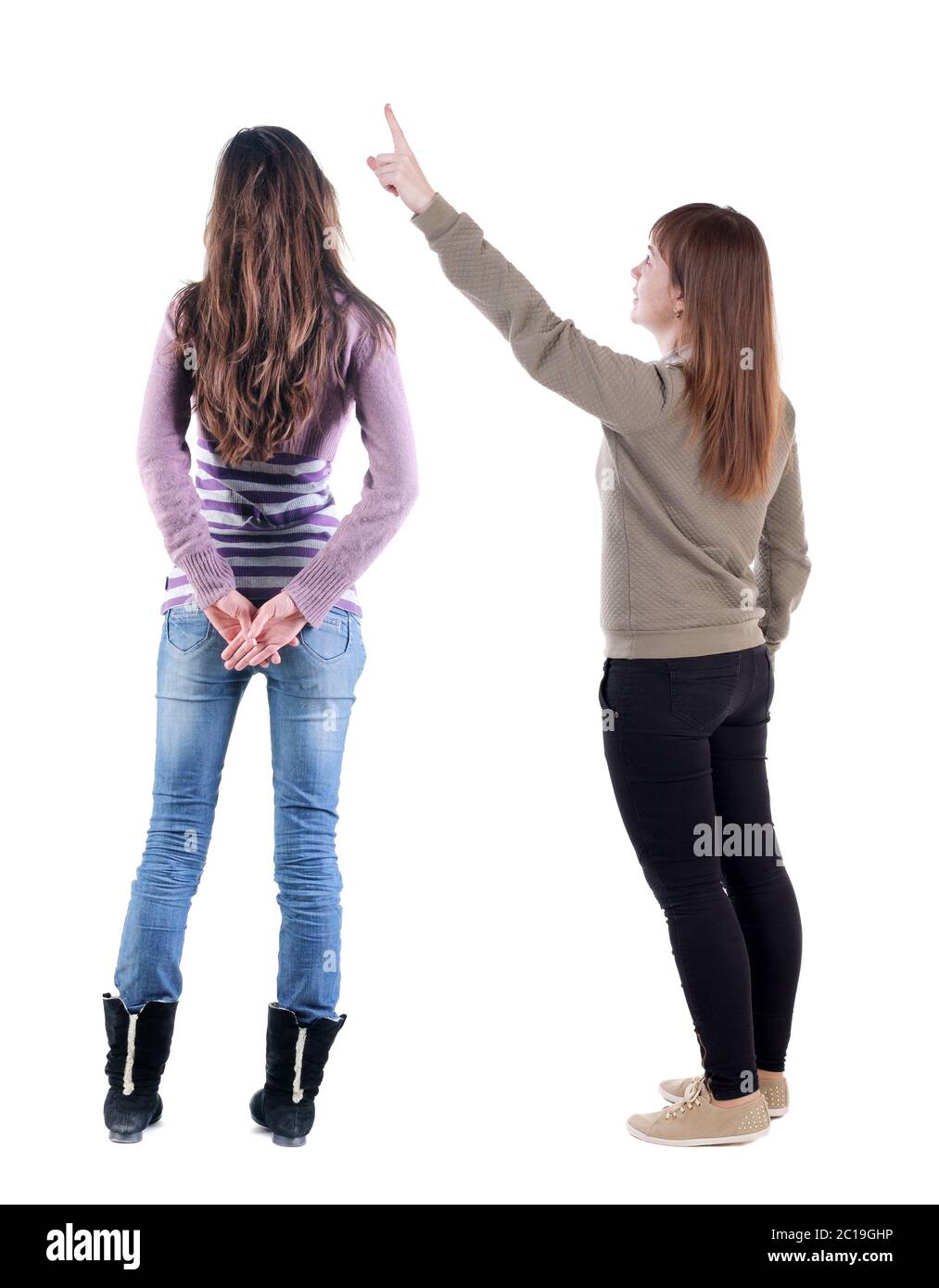 Back view of two pointing girl in sweater. Rear view people collection ...