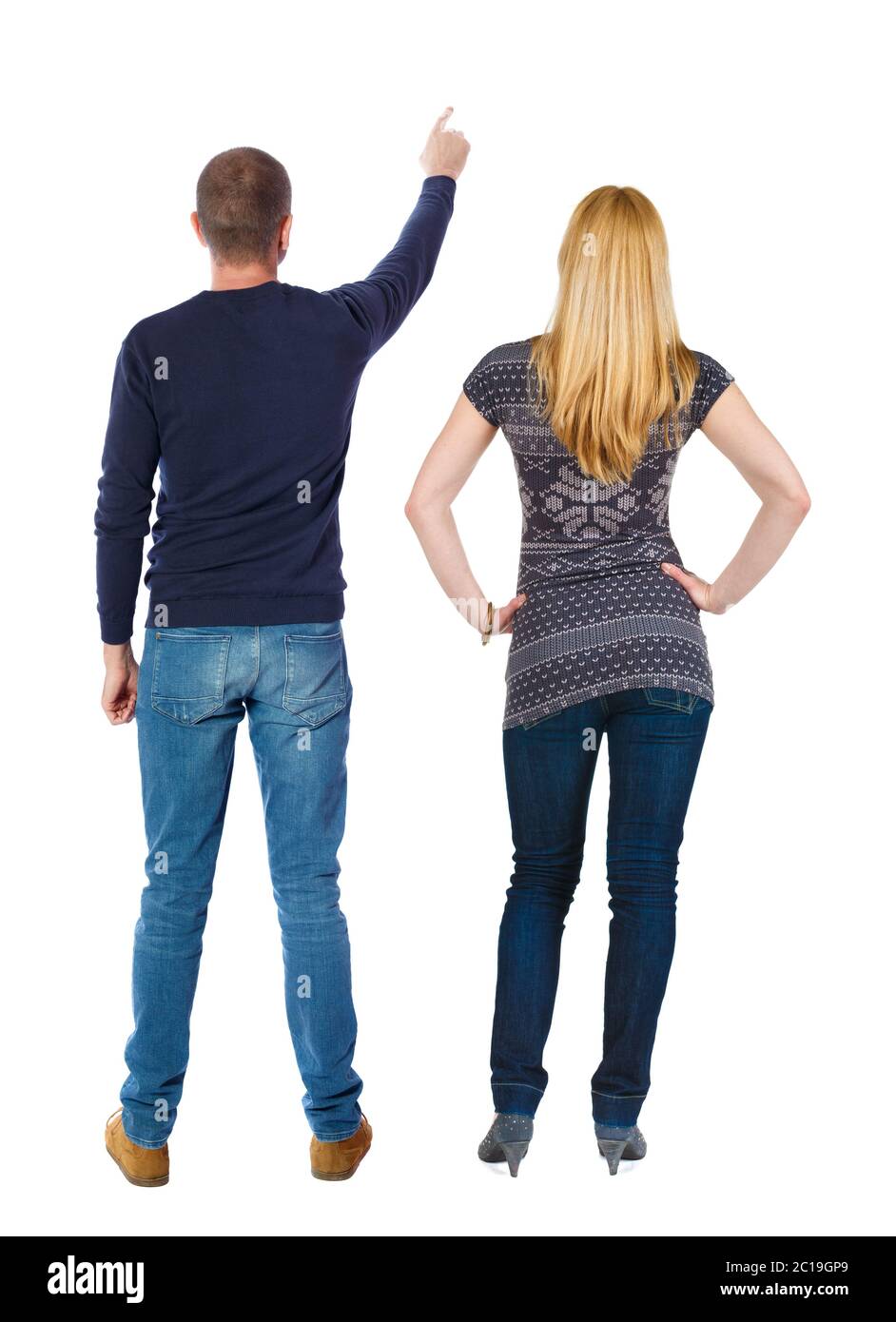 Back view of couple in sweater pointing. Rear view people collection ...