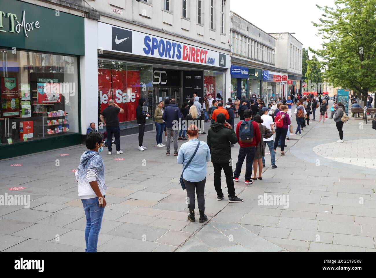 Long queue of shoppers uk high street hi-res stock photography and ...