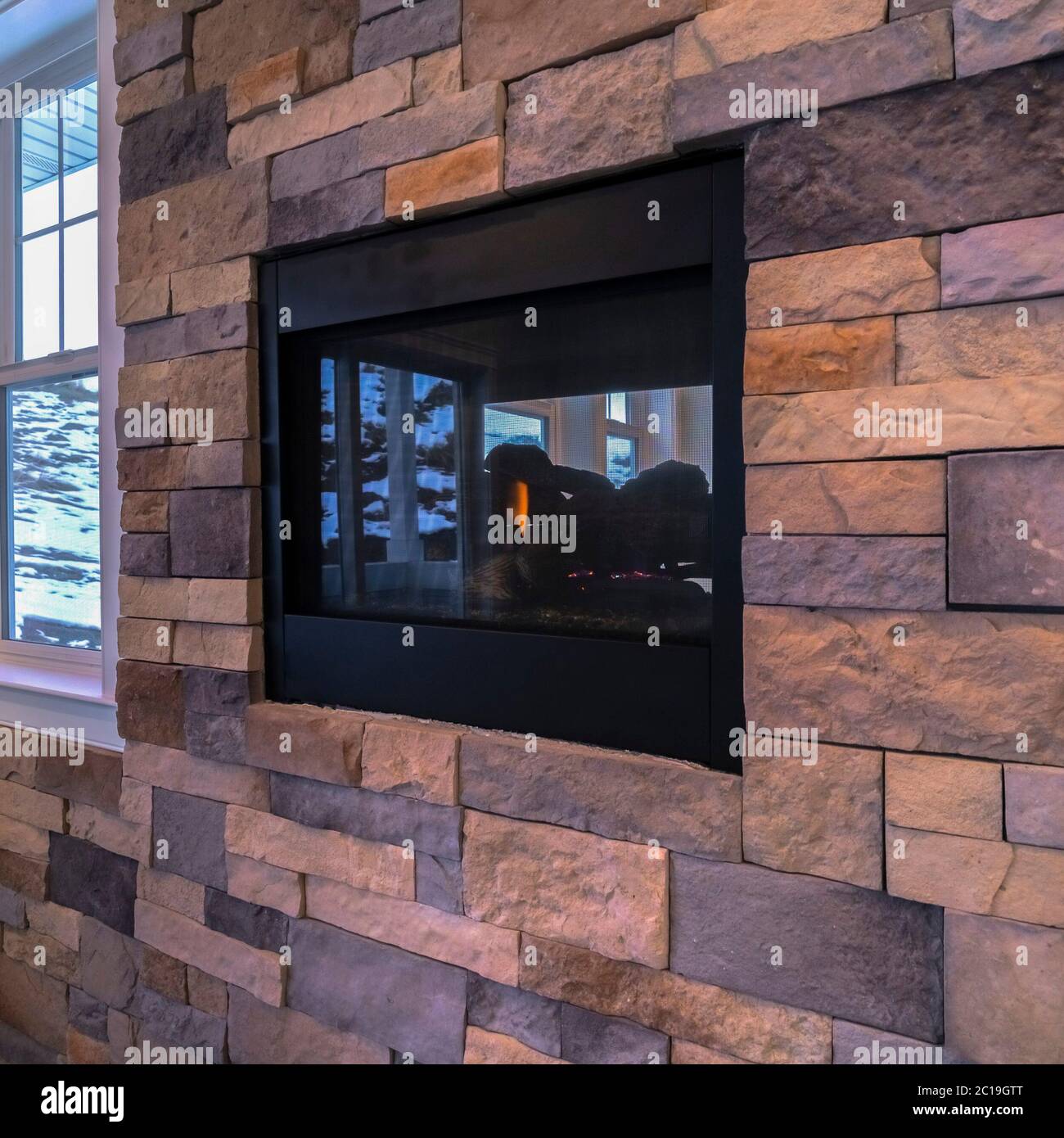 Square Fireplace mounted inside decorative wall interior brick Stock ...