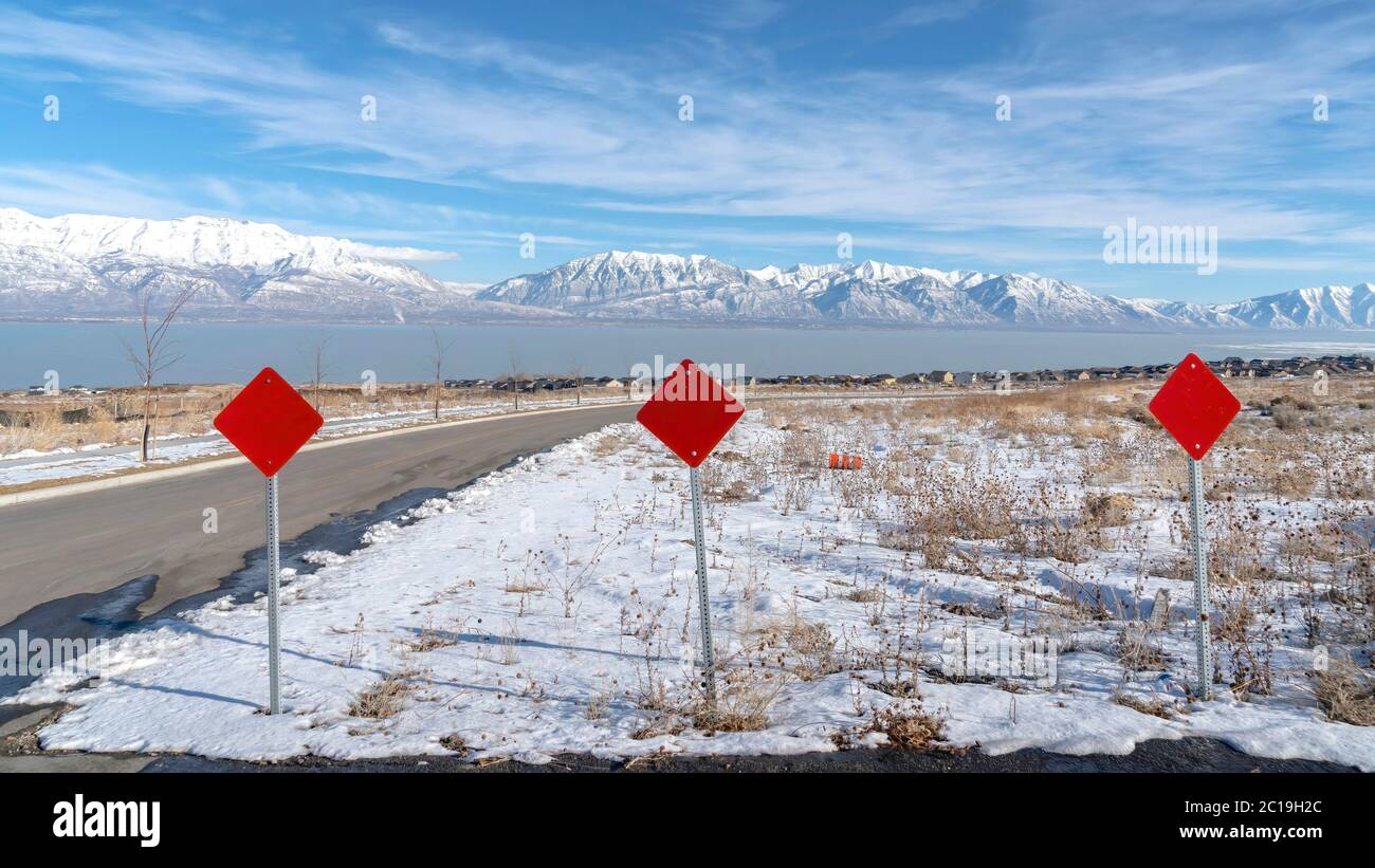Panorama Diamond shaped traffic signs on road with Wasatch Mountains ...