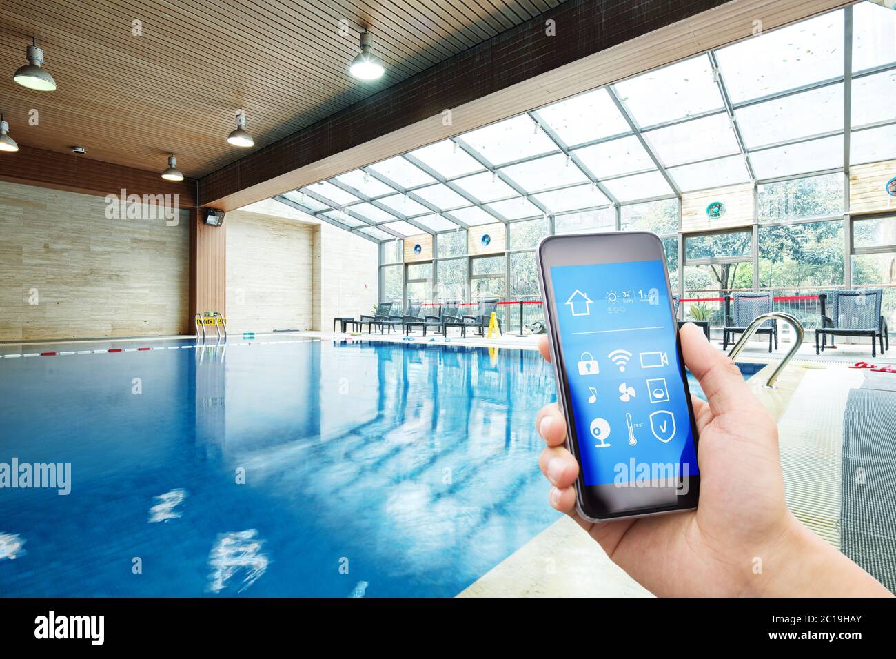 smart phone with smart home with modern swimming pool Stock Photo - Alamy