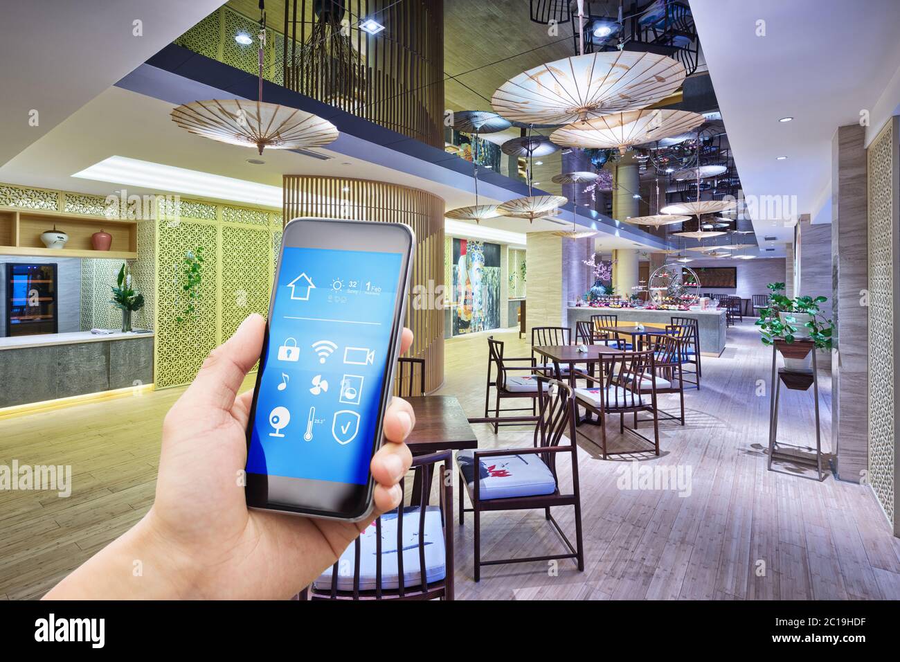 smart phone with smart home with modern dining room Stock Photo - Alamy