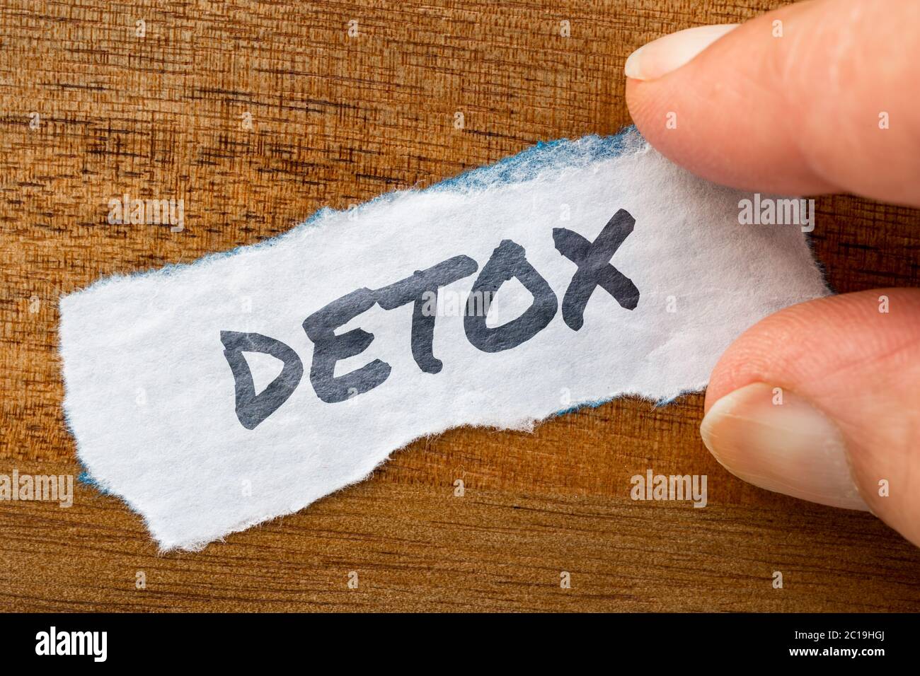 Detox concept and theme written on old paper on a grunge background ...