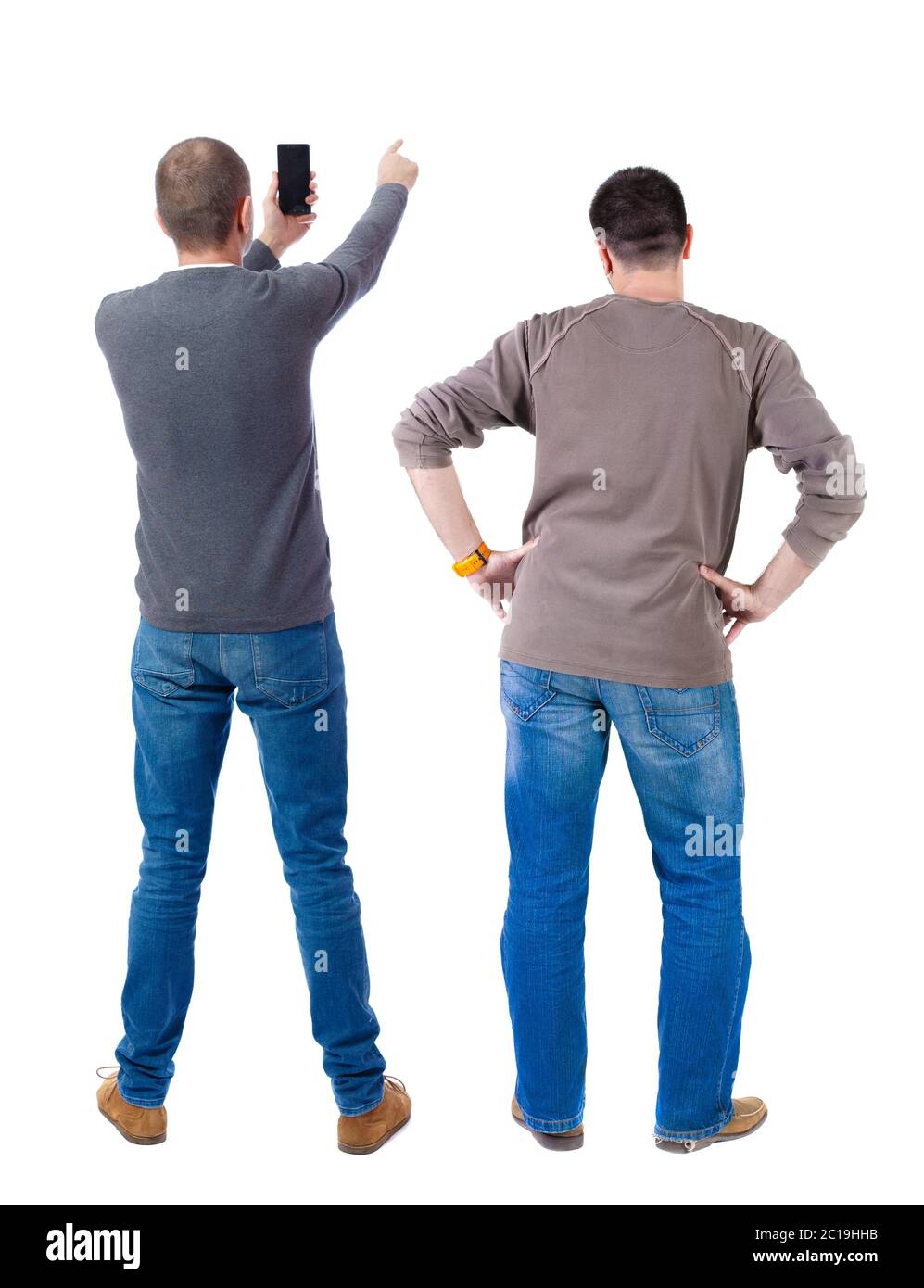 Back view of two man in sweater with mobile phone. Rear view people ...