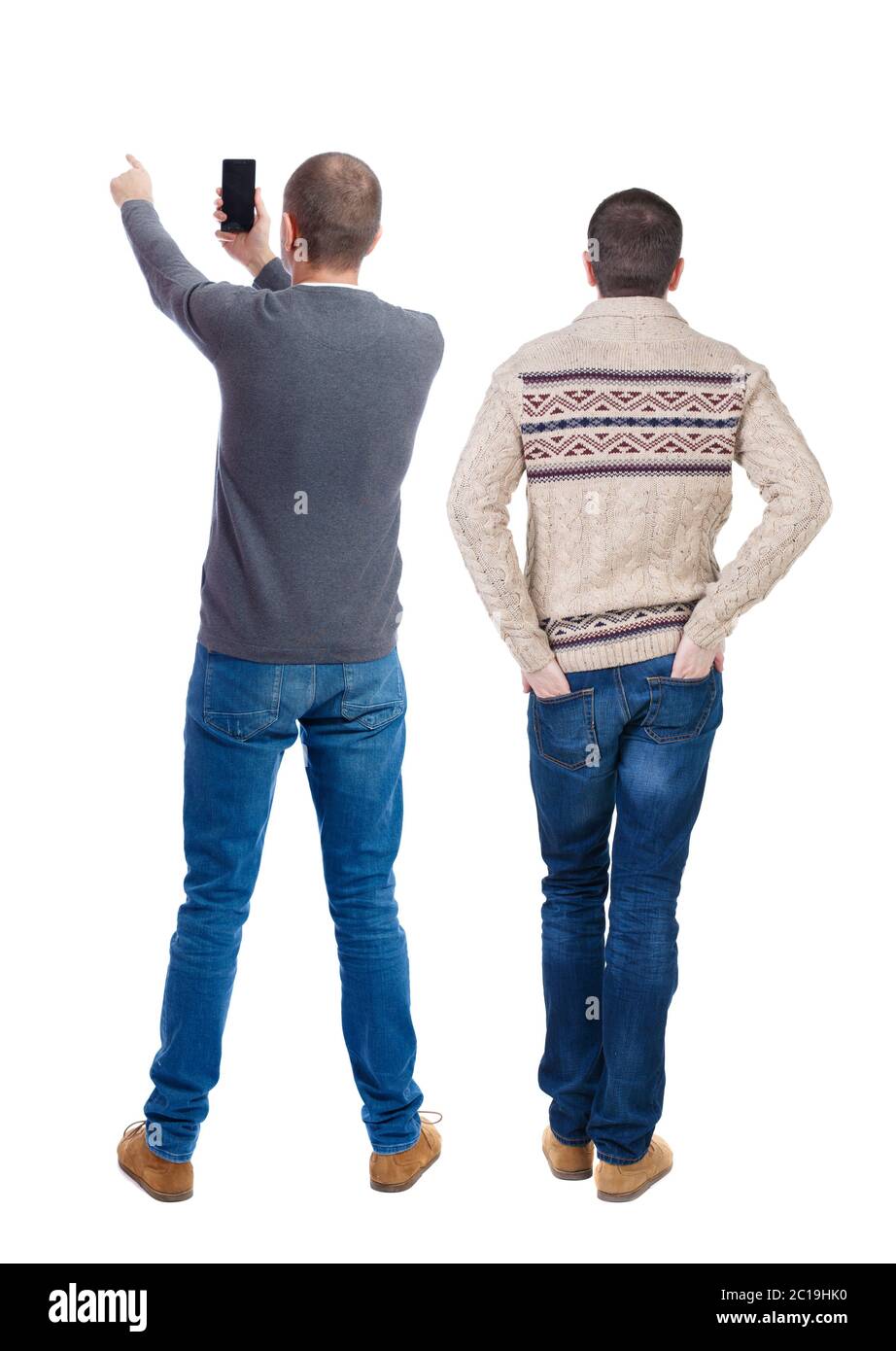 Back view of two man in sweater with mobile phone. Rear view people ...