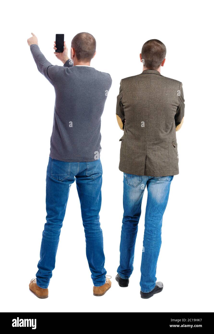 Back view of two man in sweater with mobile phone. Rear view people ...