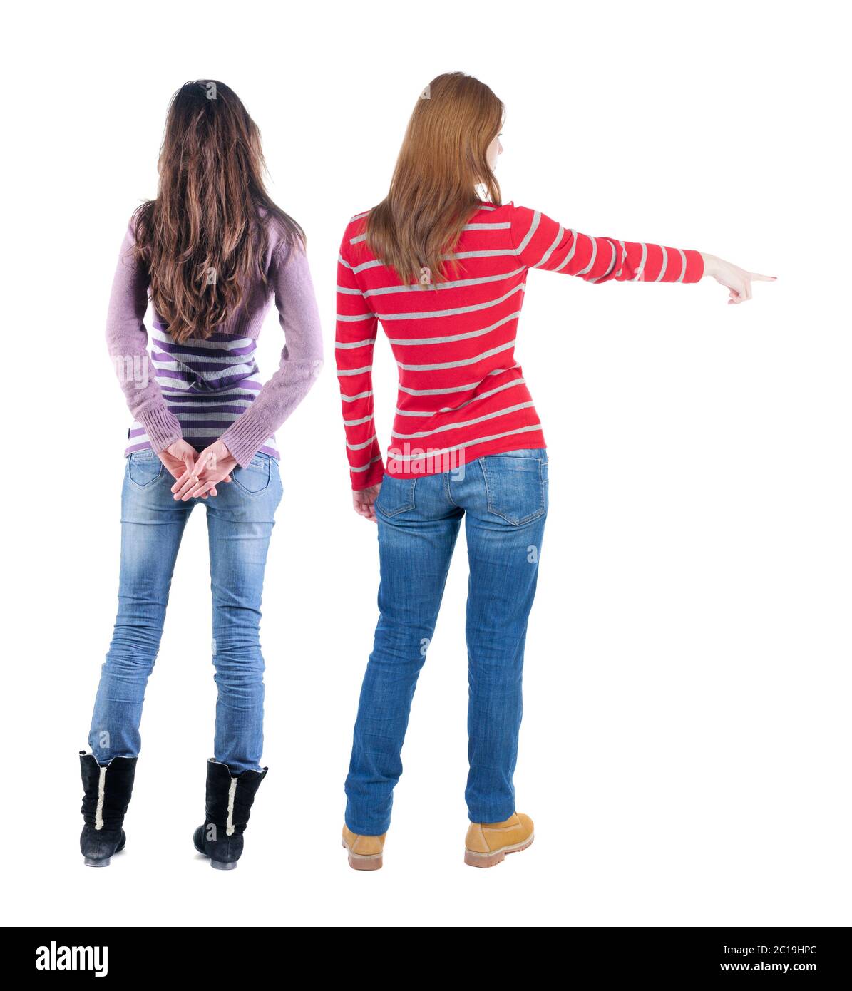 Back view of two pointing girl in sweater. Rear view people collection ...