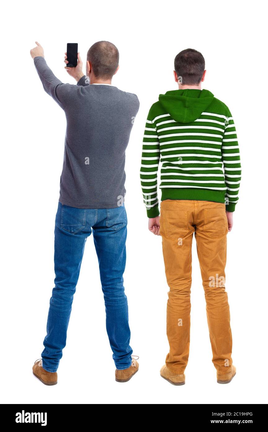 Back view of two man in sweater with mobile phone. Rear view people ...