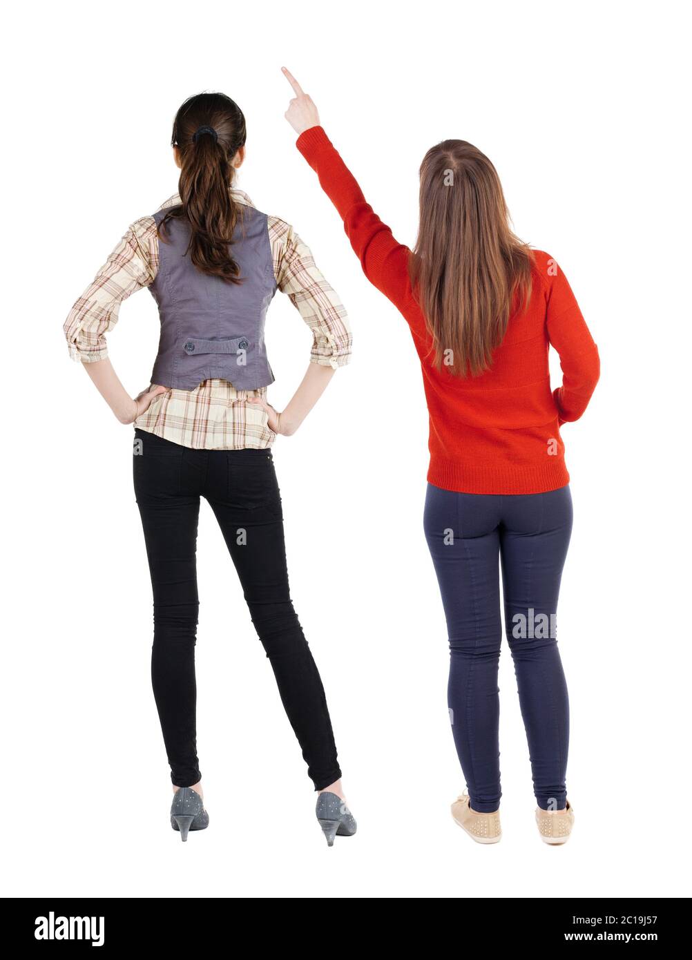 Back view of two pointing girl in sweater. Rear view people collection ...