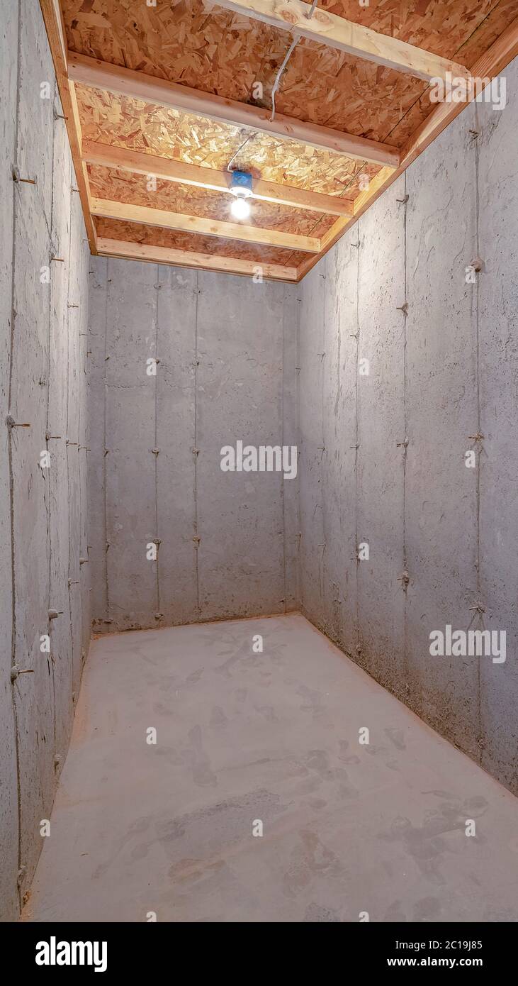 Vertical frame Narrow corridor or room in new built house Stock Photo ...