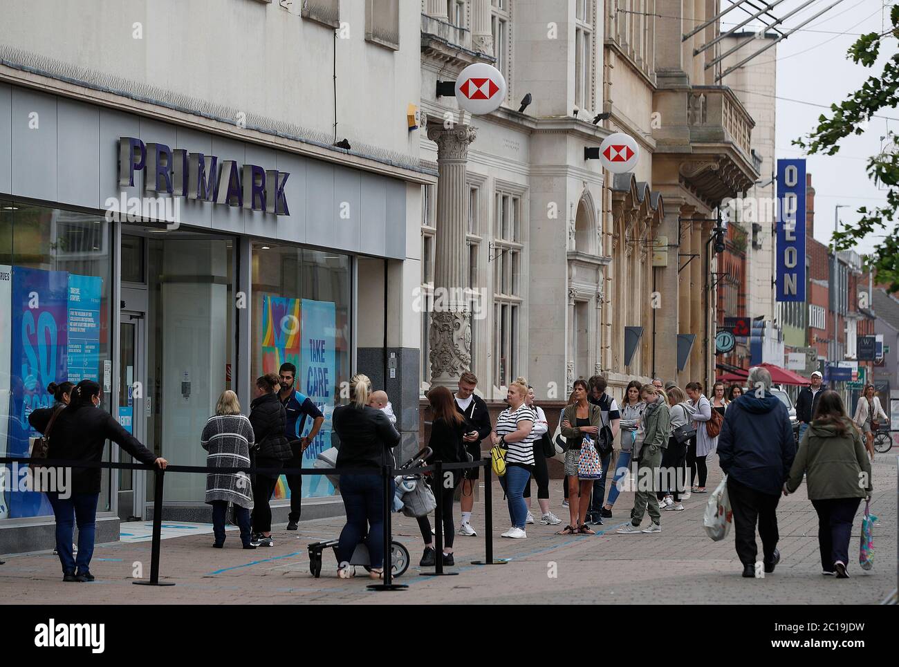 Loughborough, Leicestershire, UK. 15th June 2020. Customers queue to ...